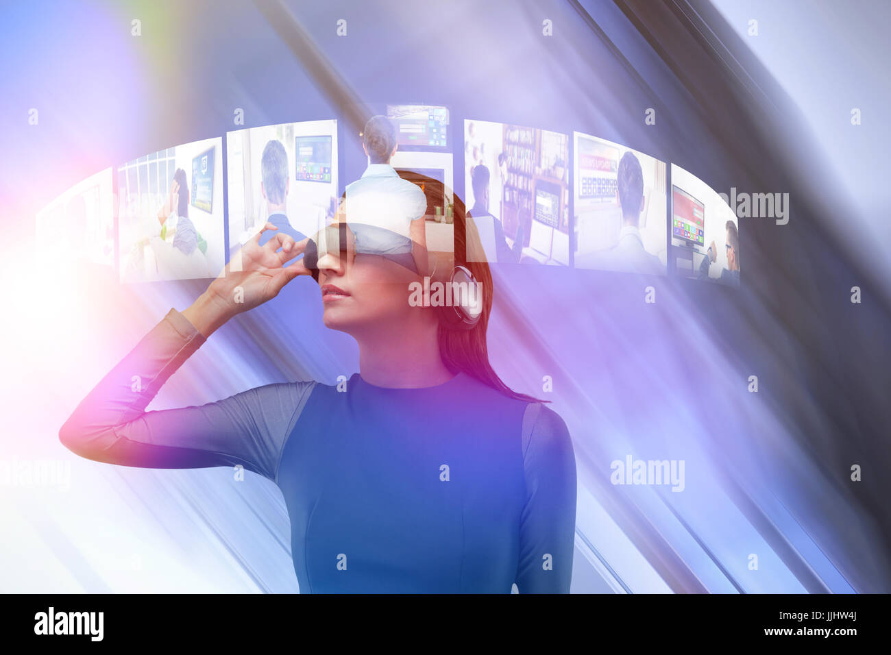 Woman wearing virtual reality glass against low angle view of glass ...