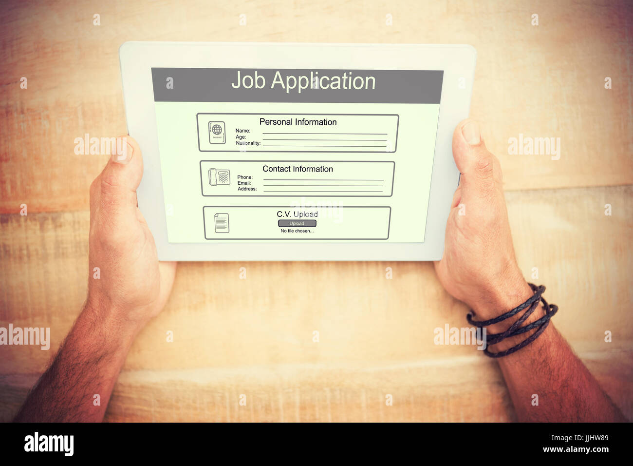 Digitally generated image of Job Application against hands holding ...
