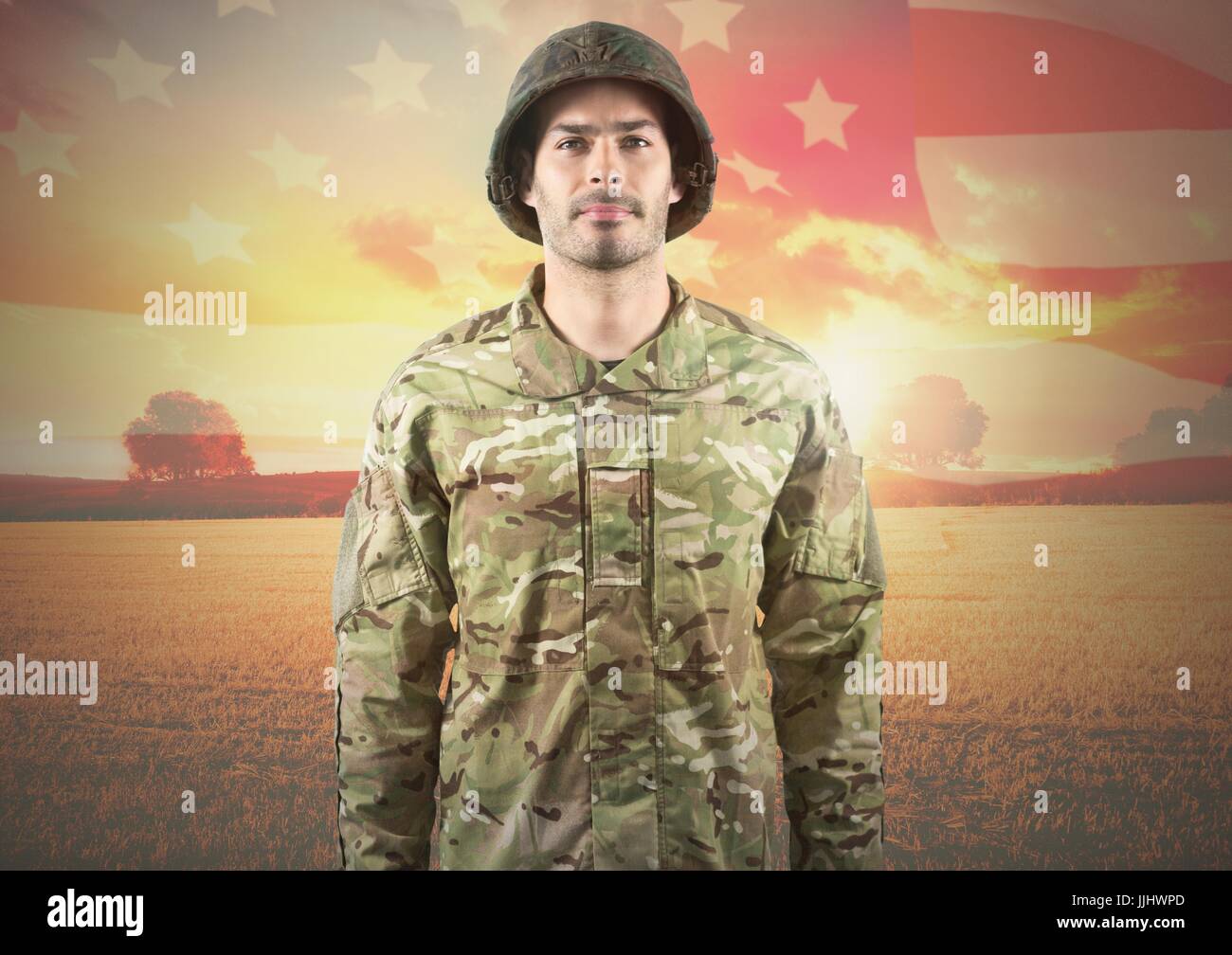 Smiling soldier standing on american flag background Stock Photo - Alamy