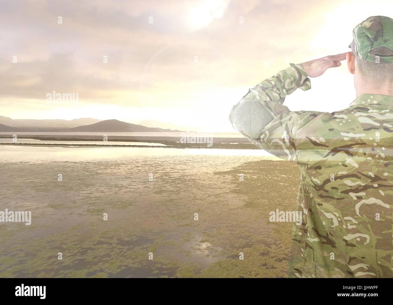 Soldier from back looking at the sunset Stock Photo - Alamy