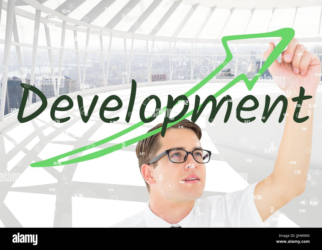 Young businessman writing DEVELOPMENT with up arrow in the office Stock ...