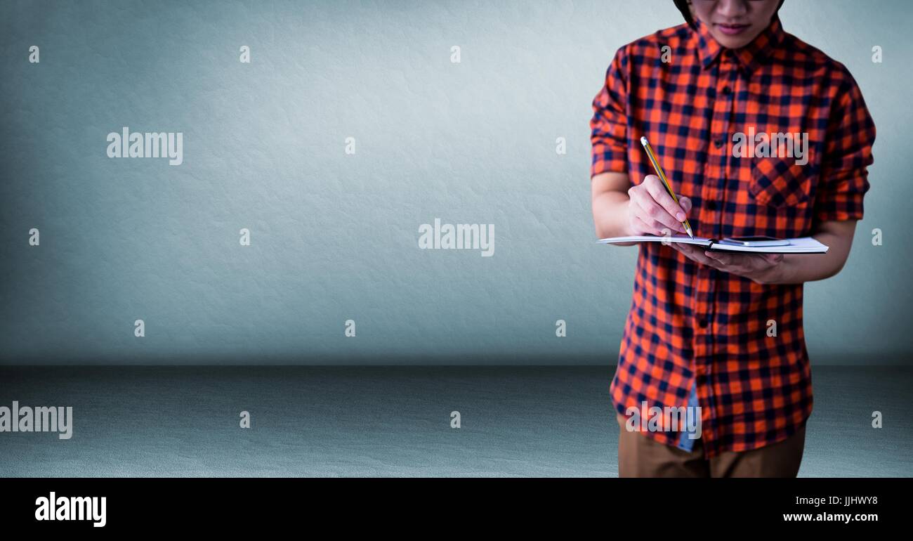 College student with notebook against blue background Stock Photo - Alamy