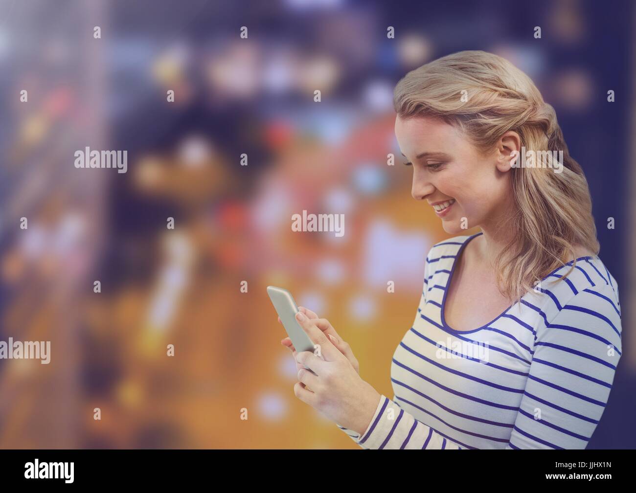 Smiling while texting hi-res stock photography and images - Alamy