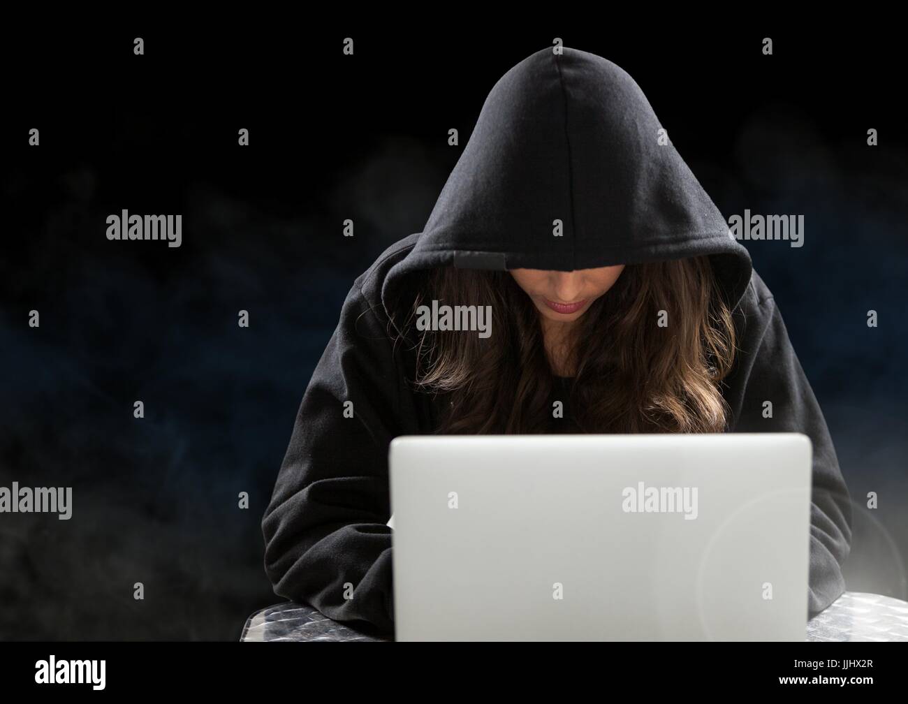 Woman hacker sitting in front hi-res stock photography and images - Alamy