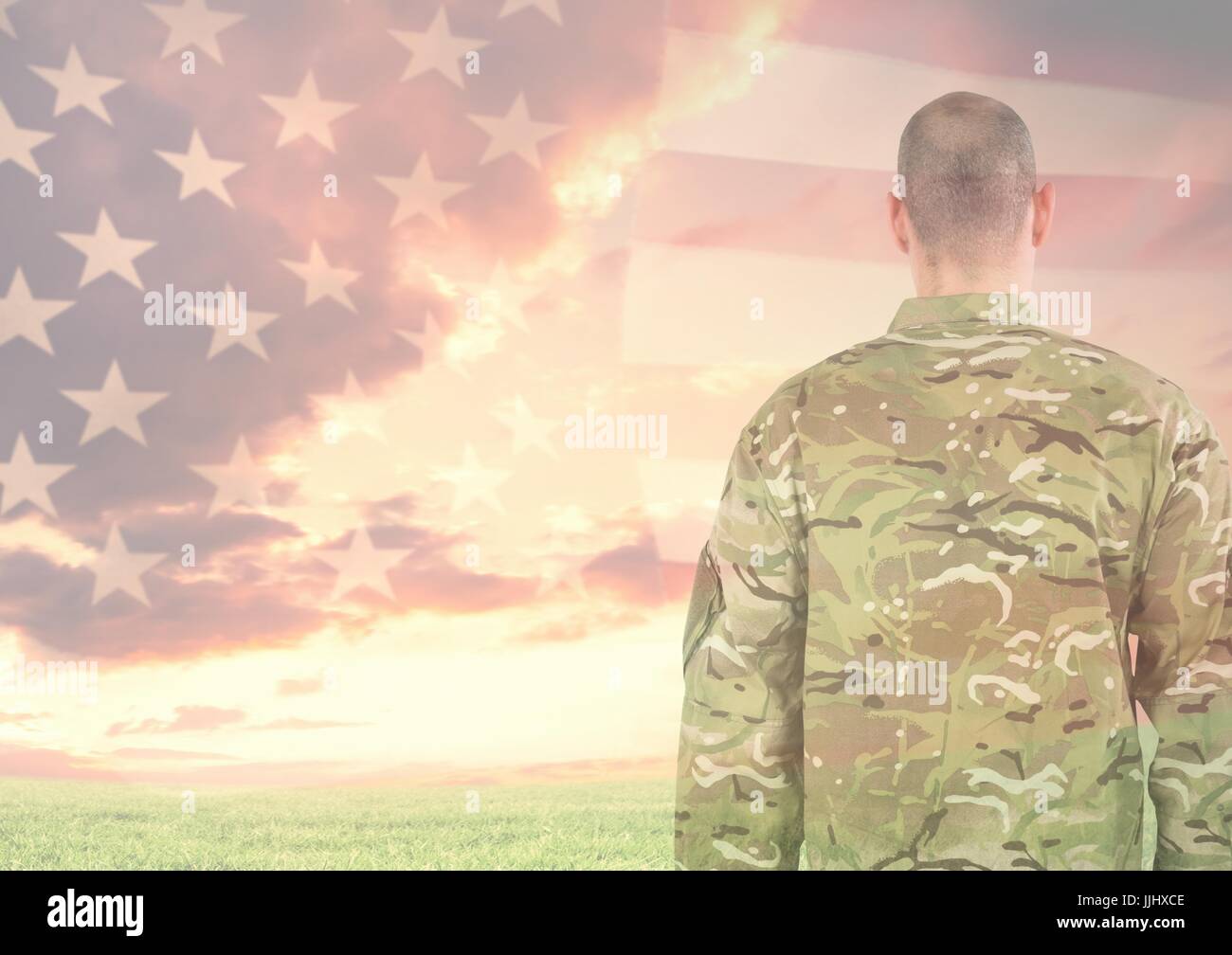 Rear view of military standing against american flag Stock Photo - Alamy
