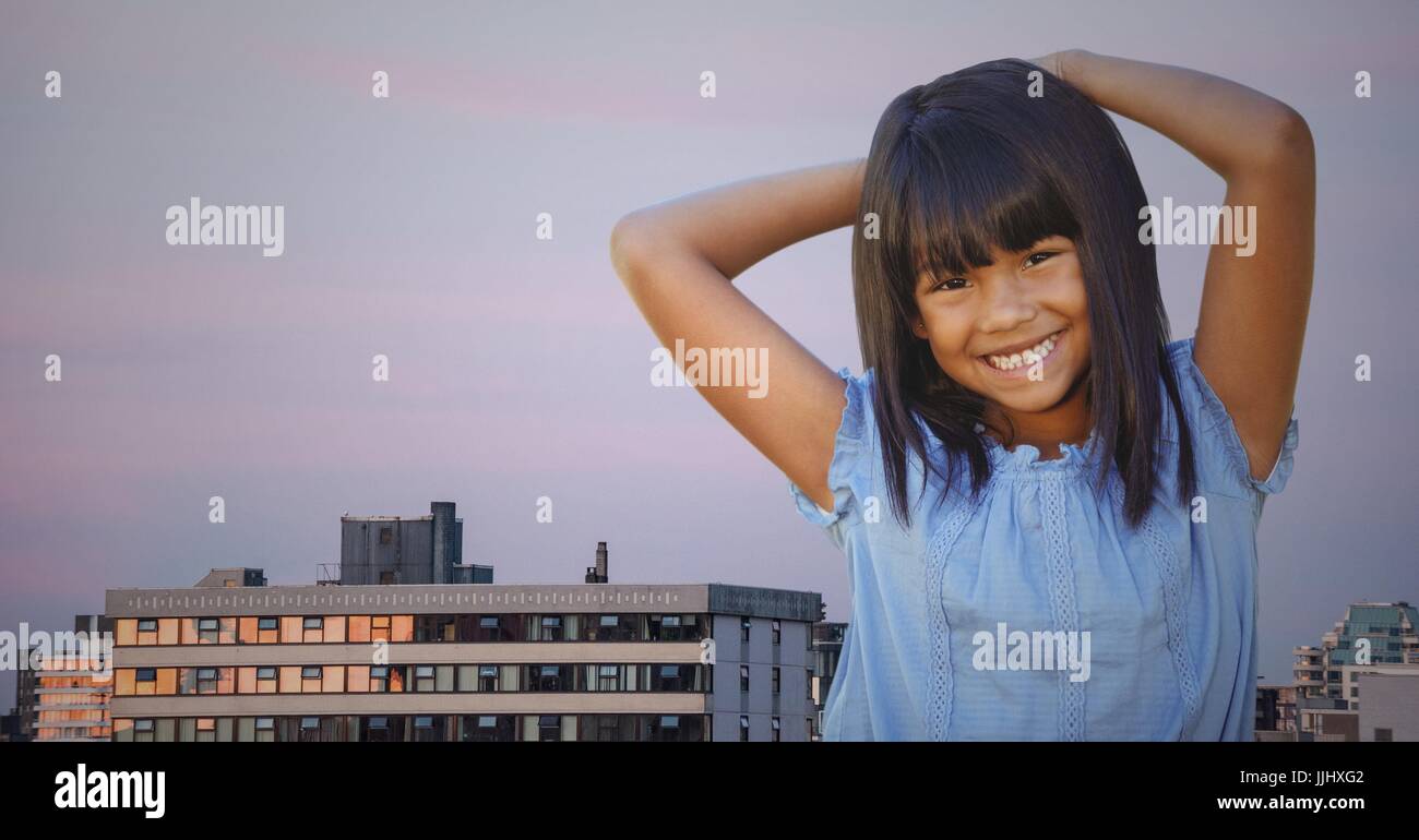 Girl hands on head against buildings and evening sky Stock Photo - Alamy
