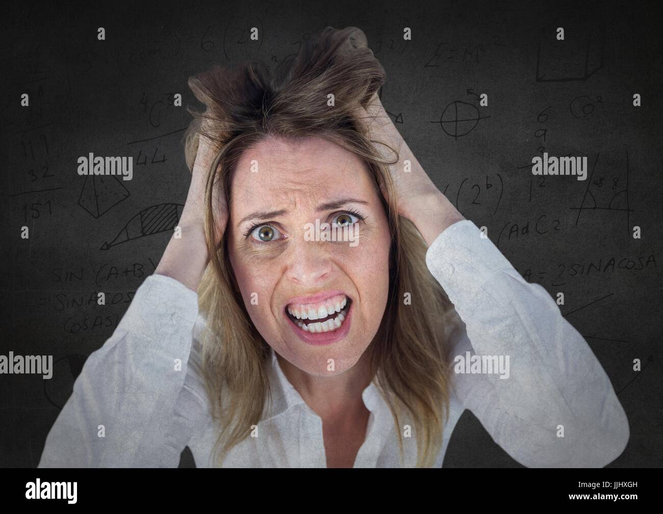 Frustrated business woman against grey wall and math graphics Stock ...