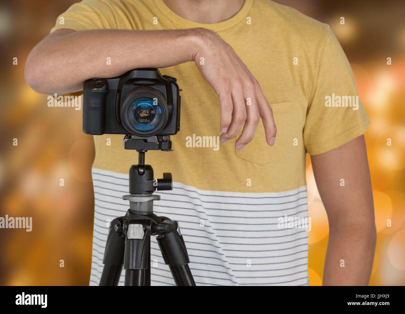 photographer rest on tripod with camera. Blurred city lights back Stock ...