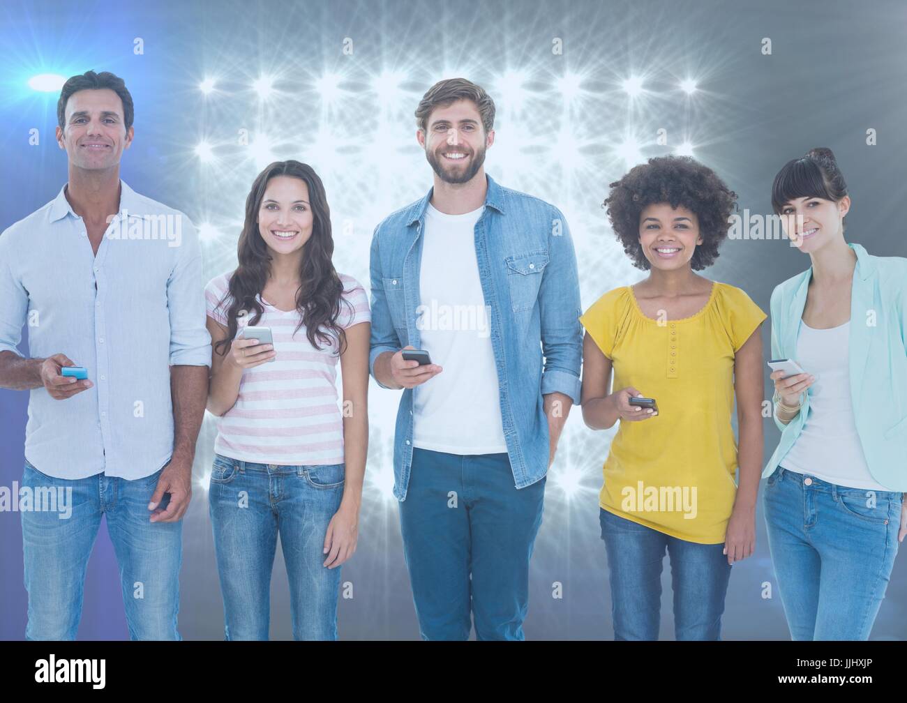 Happy friends texting together Stock Photo - Alamy