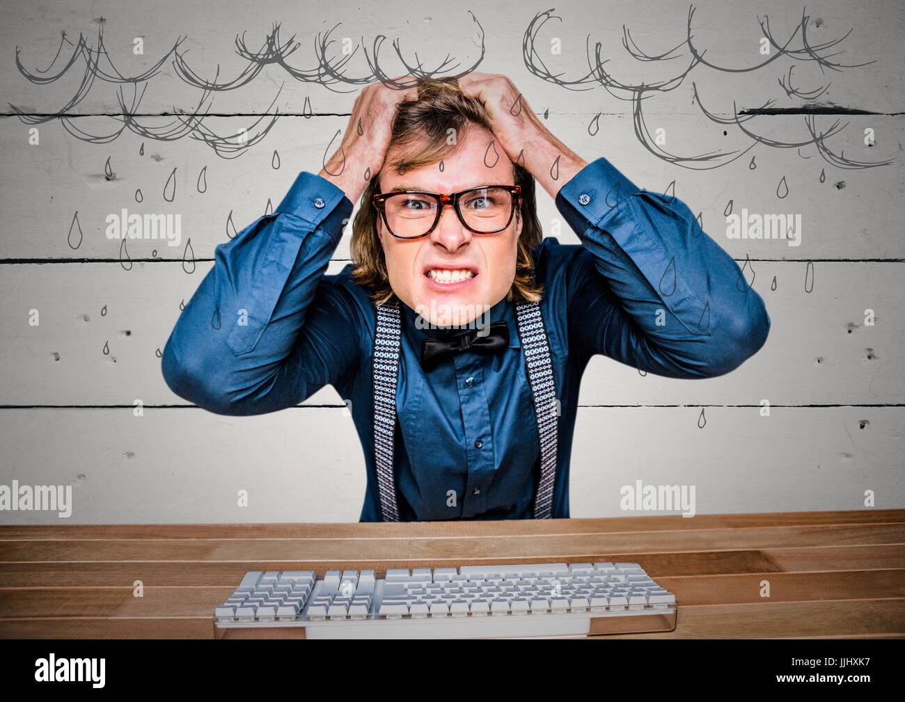 Frustrated business man at desk against white wood panel and rain ...