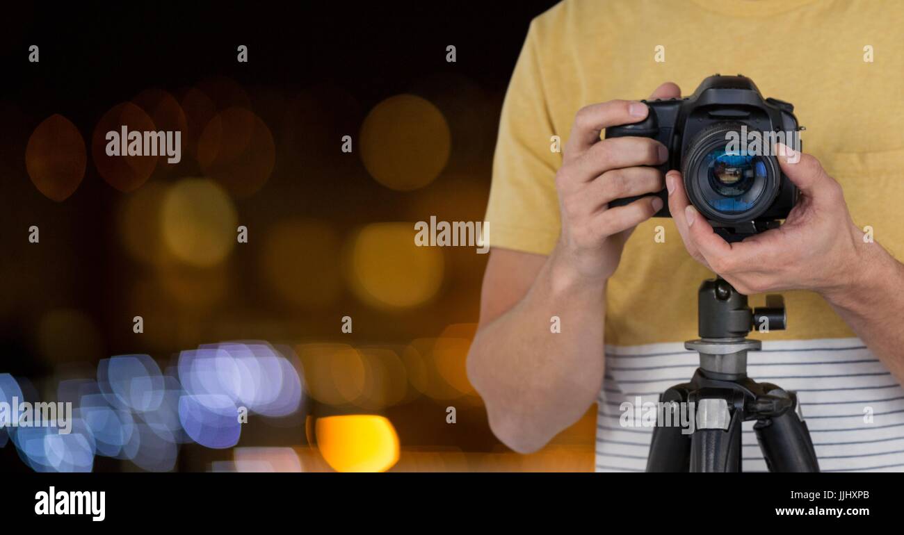 Part of Photographer taking pictures against glowing background Stock ...