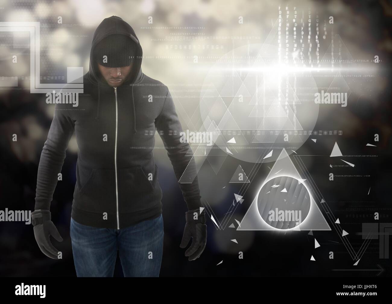 Hacker standing up in front of digital background Stock Photo - Alamy
