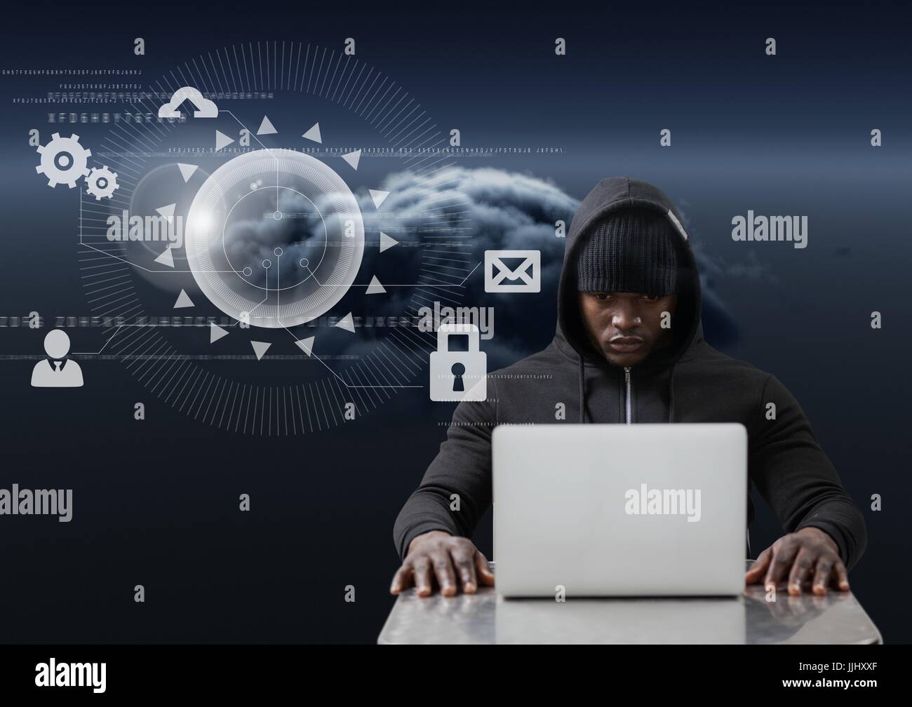 Hacker using a laptop in front of digital graphics Stock Photo - Alamy