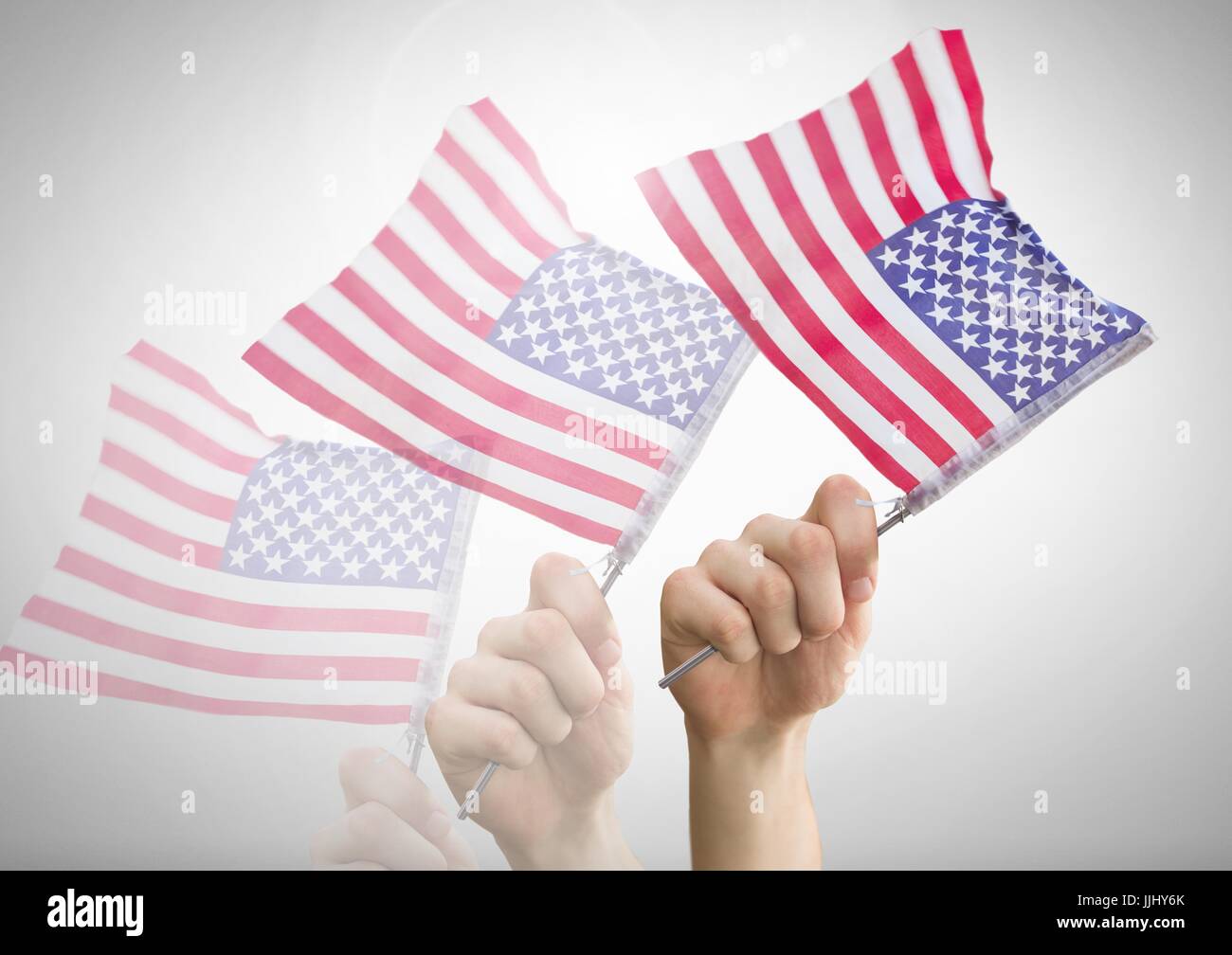 Hand shaking american flags Stock Photo - Alamy