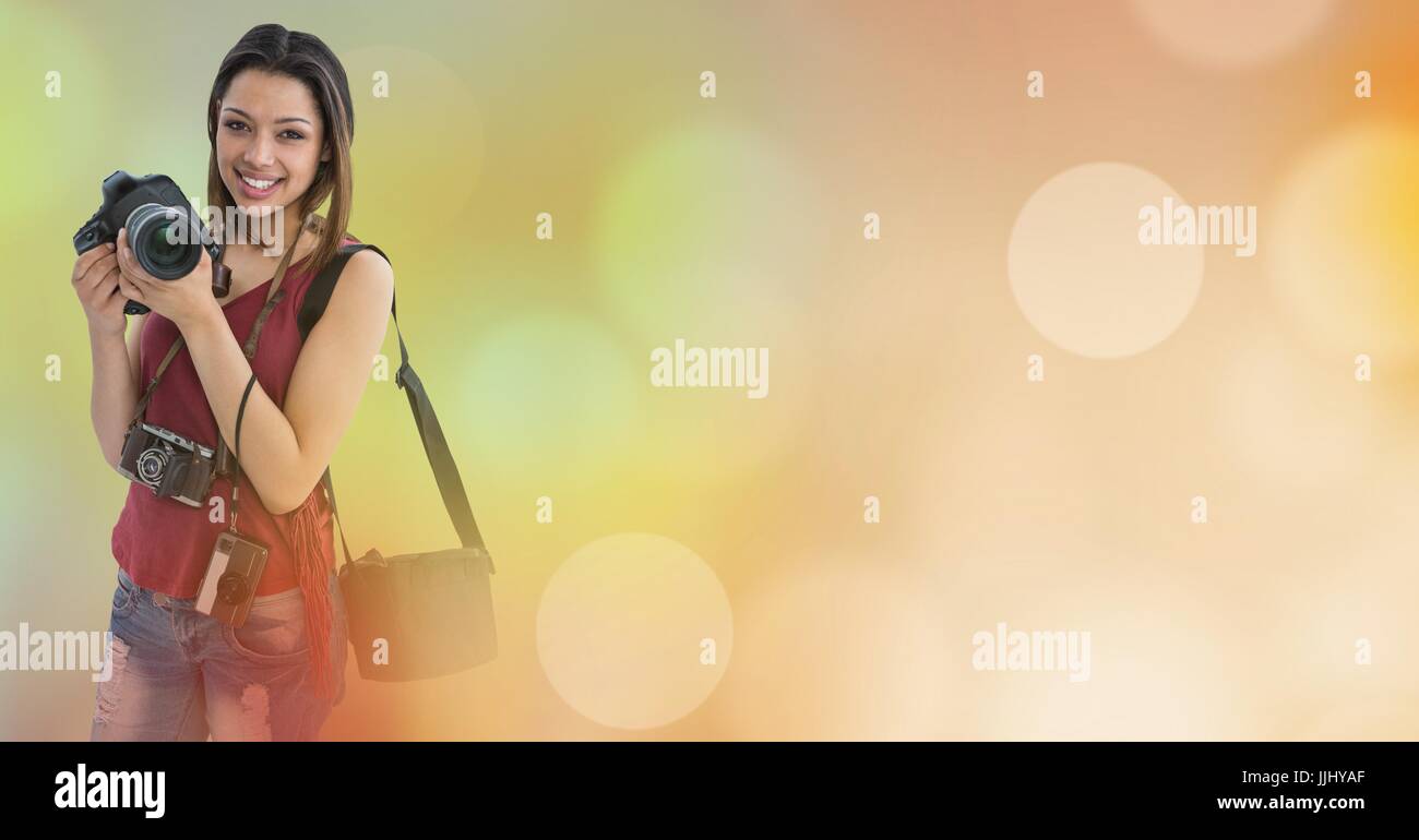 Photographer smiling against green glowing background Stock Photo - Alamy