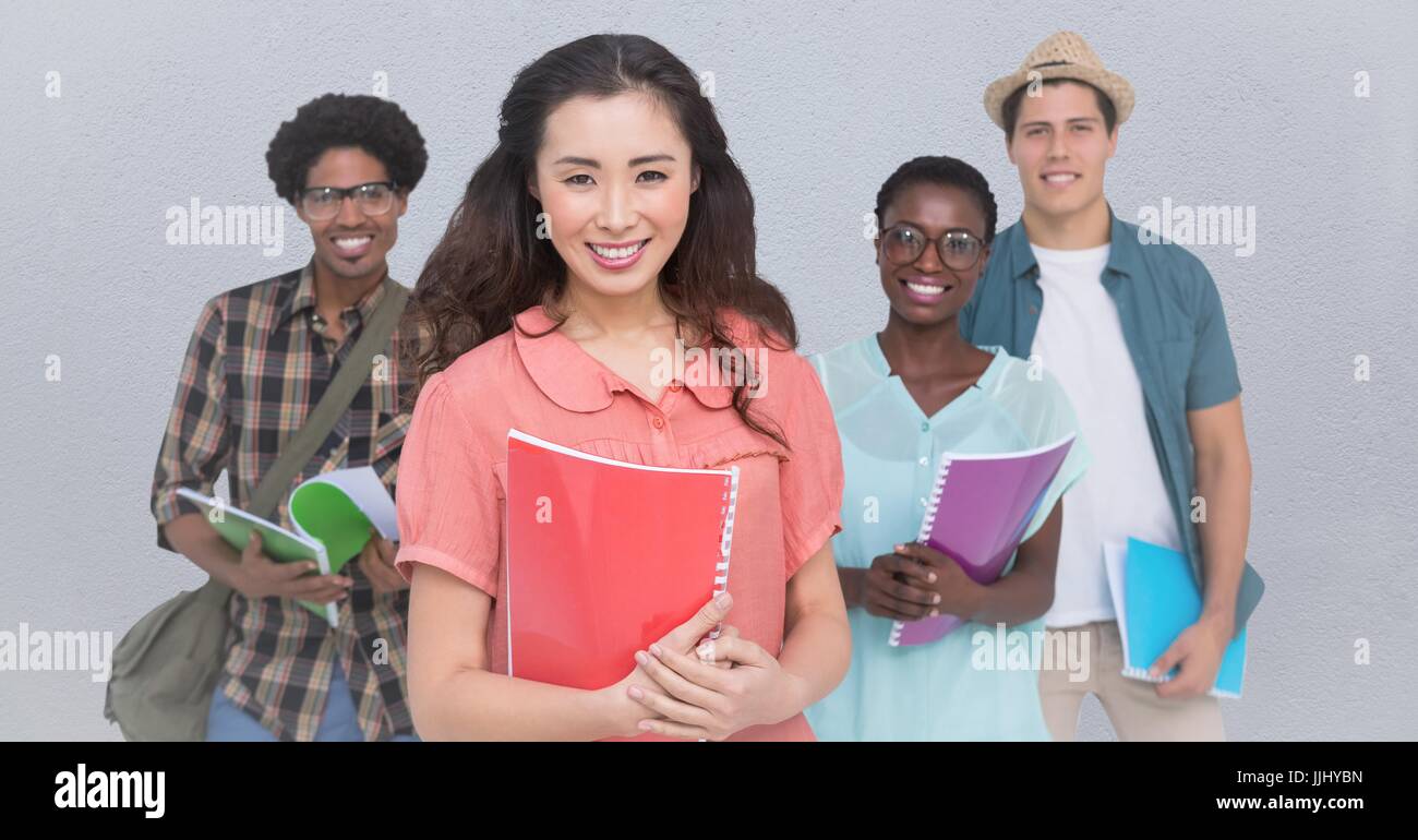 College students against grey wall Stock Photo - Alamy