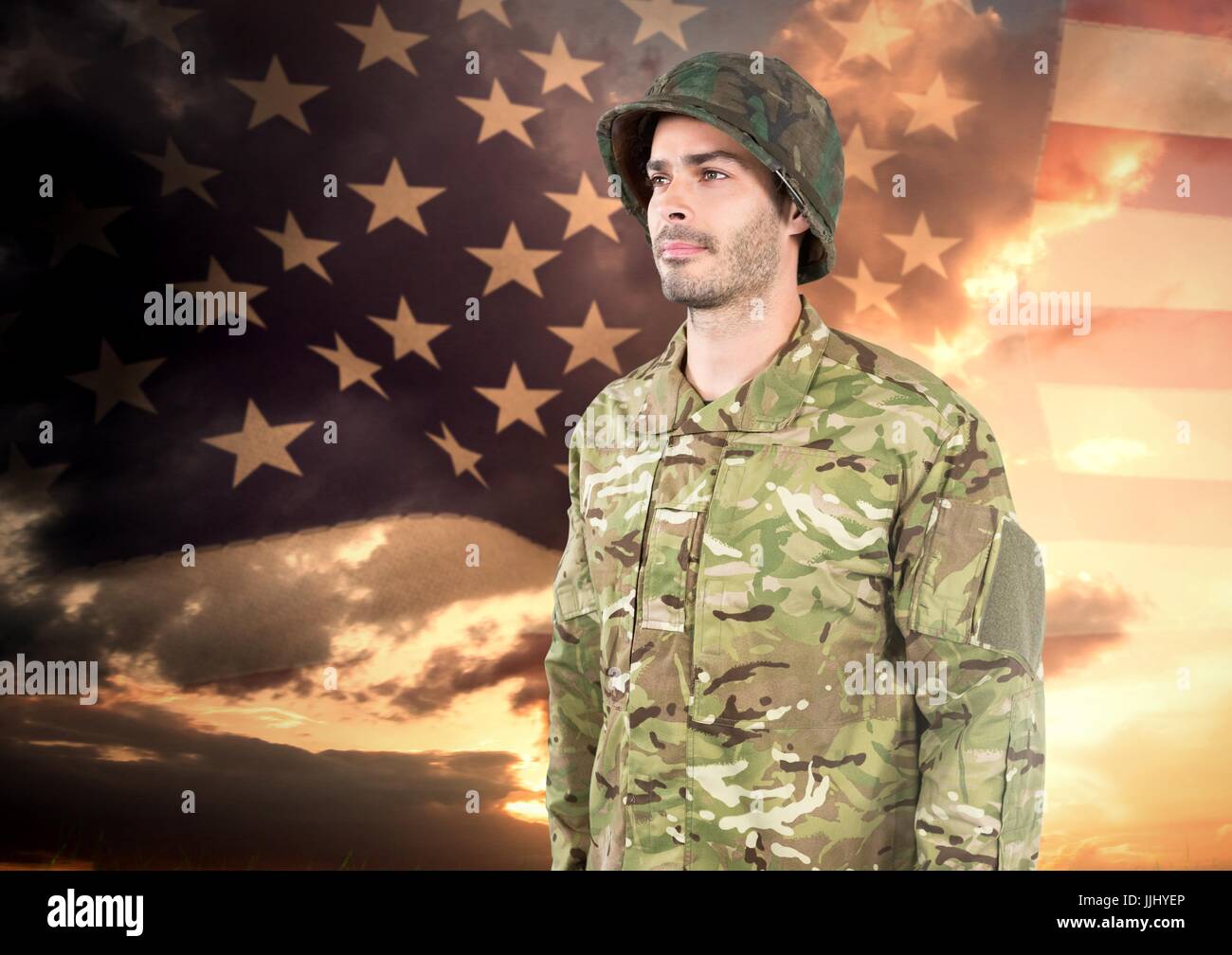 Happy soldier standing on american flag background Stock Photo - Alamy