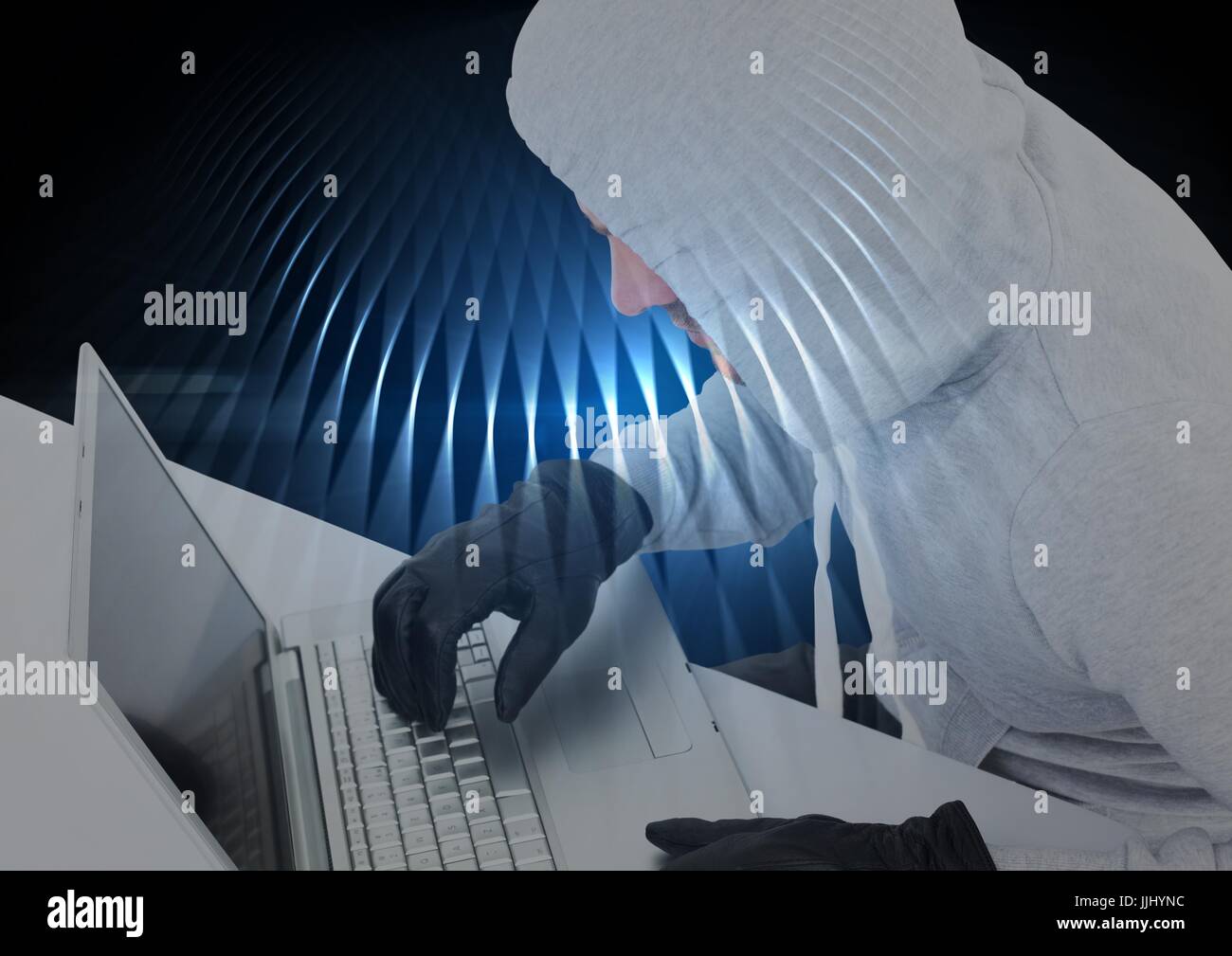 Hacker working on laptop in front of black background Stock Photo - Alamy