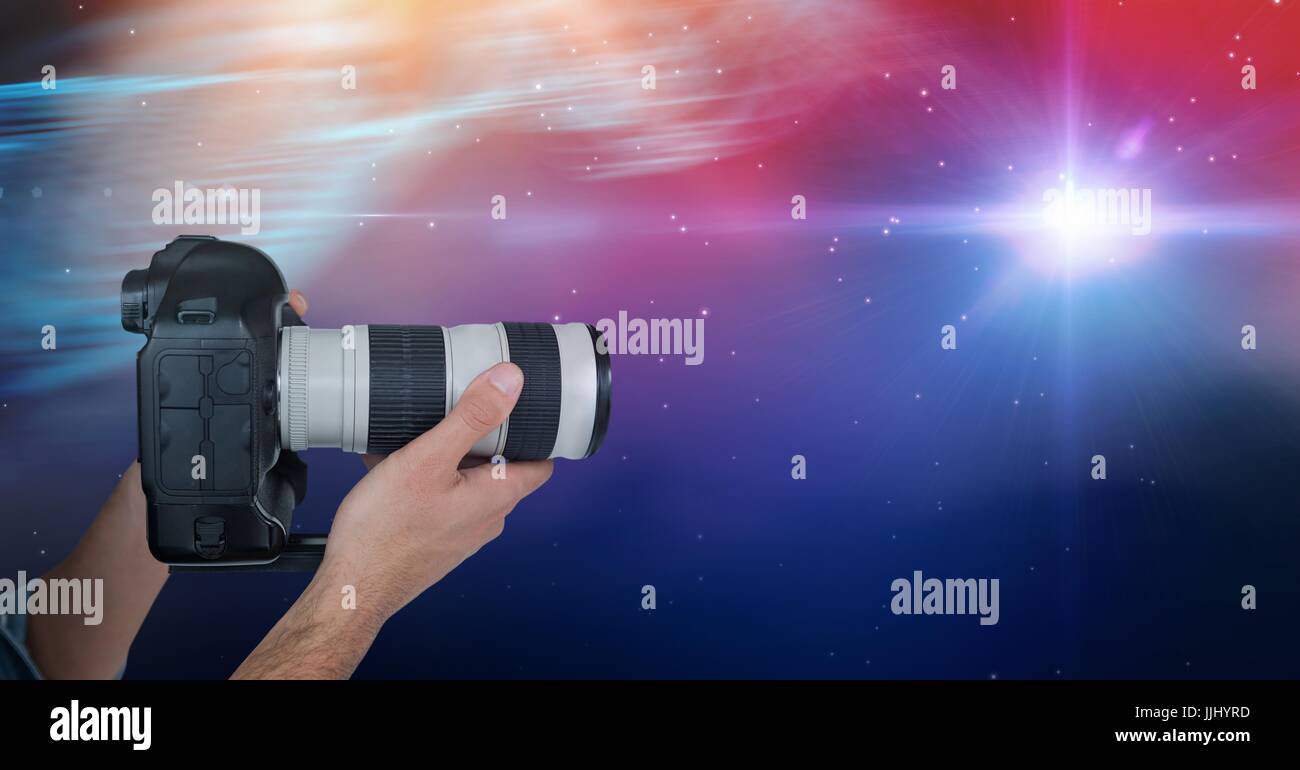 Part of a photographer taking picture in colored lights background ...