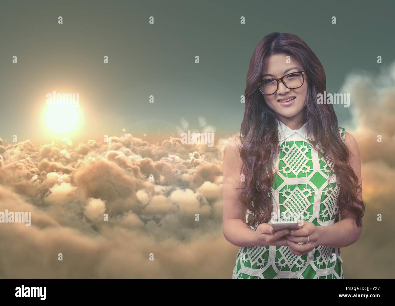 Smiling woman texting against 3D cloudy sky with sun background Stock ...