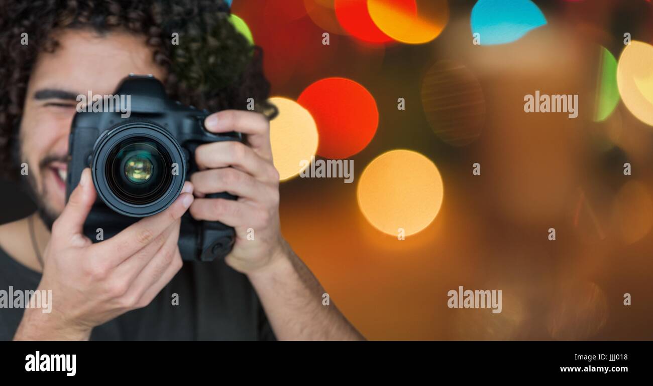 Photographer taking picture in front of camera Stock Photo - Alamy