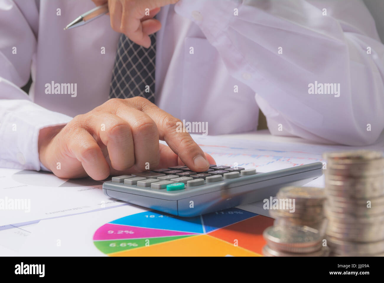 Working with the calculator hi-res stock photography and images - Alamy