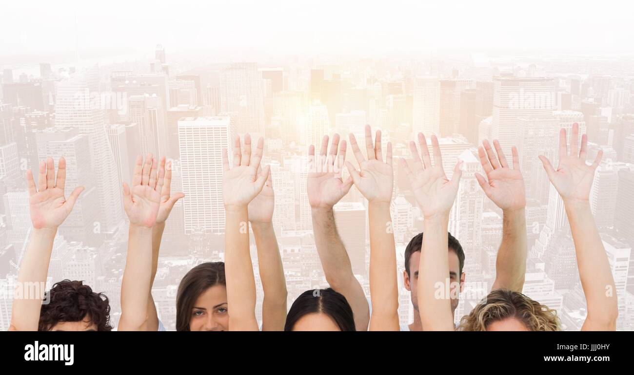 Hands up against buildings on background Stock Photo - Alamy