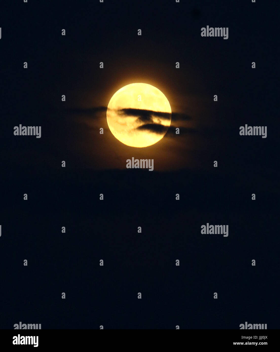 Full moon with clouds Stock Photo - Alamy