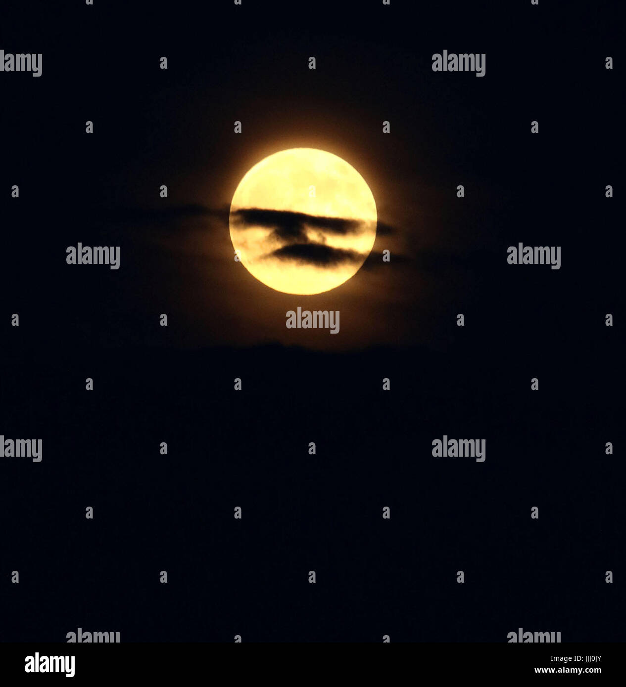 Full moon with clouds Stock Photo - Alamy