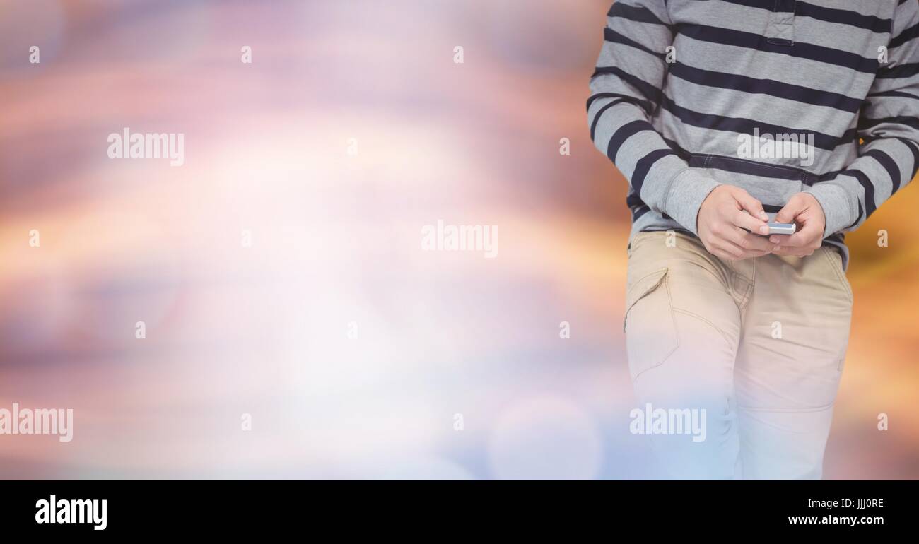 Part of a man texting in colored lights background Stock Photo - Alamy