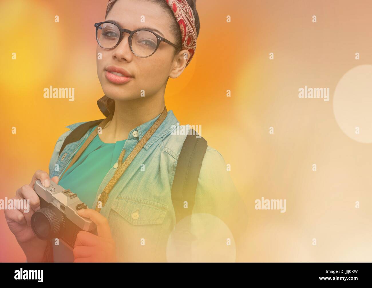 Smiling photographer standing in colored fog Stock Photo - Alamy