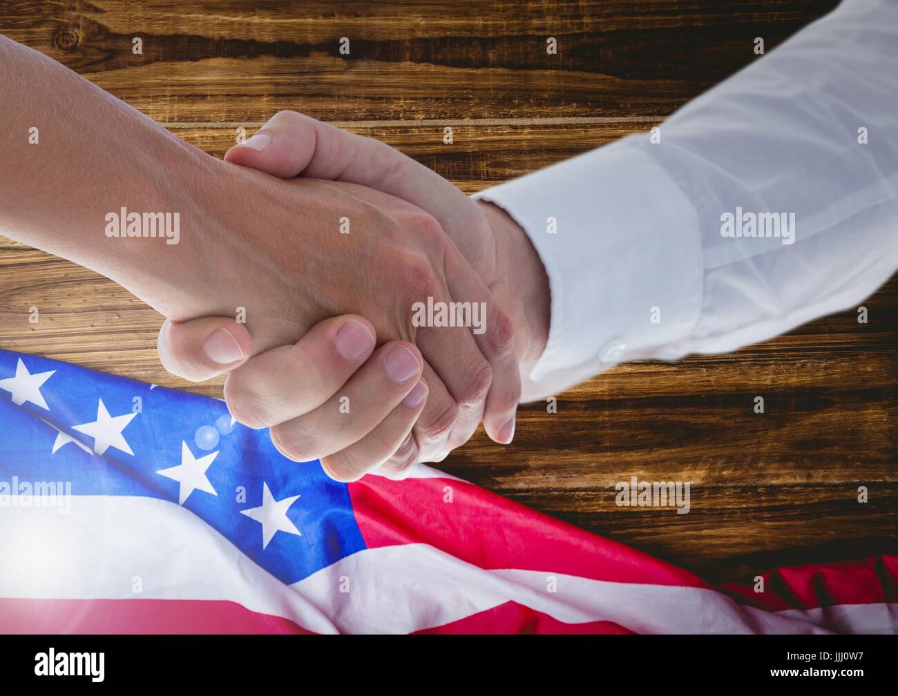 people shaking their hands against american flag Stock Photo - Alamy