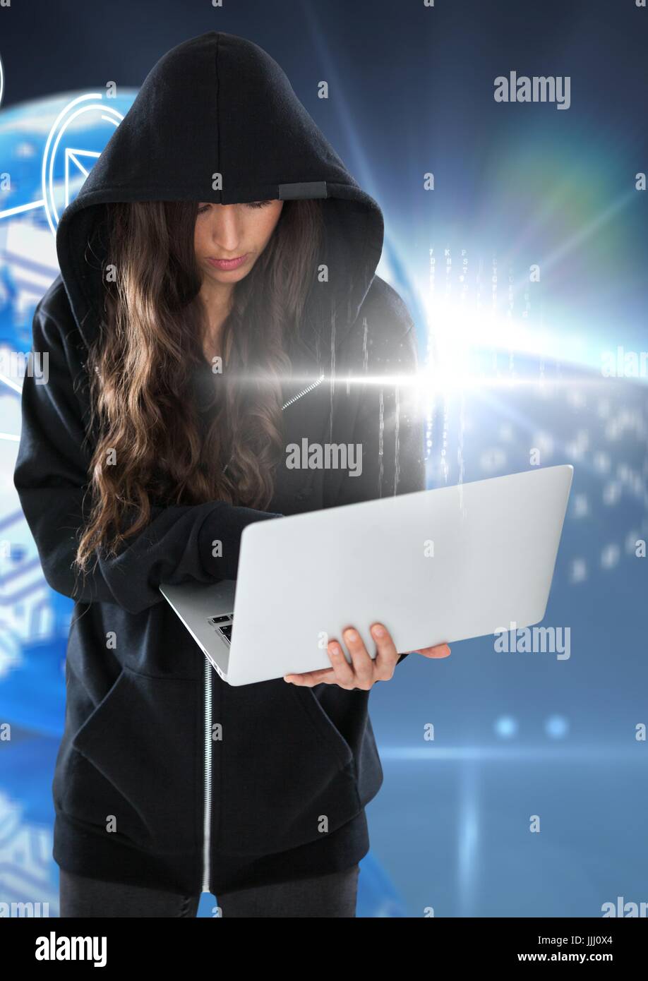 Woman hacker using a laptop in front of blue digital background Stock ...