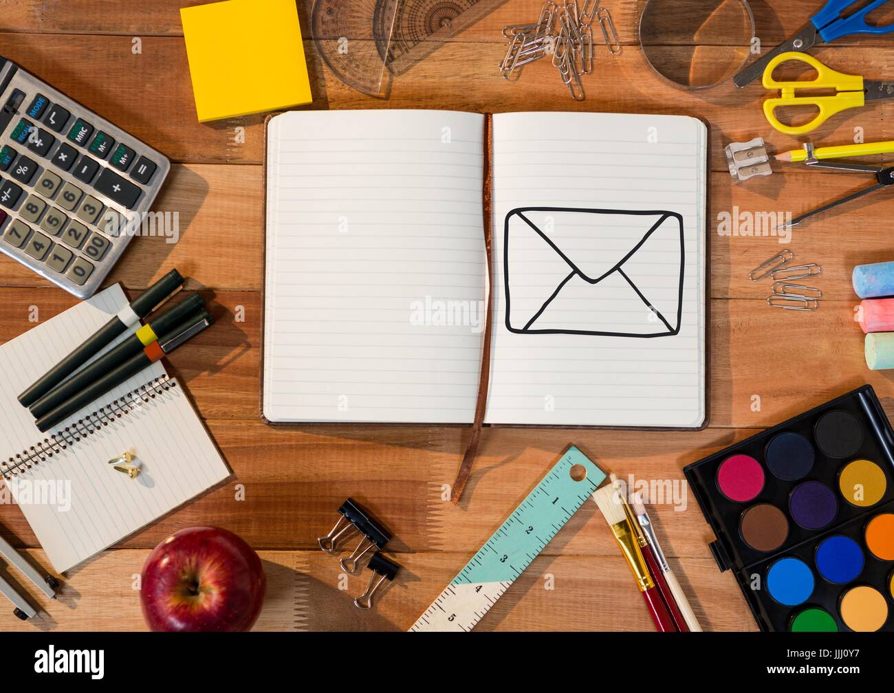 Mail doodle on notepad surrounded by stationary Stock Photo - Alamy