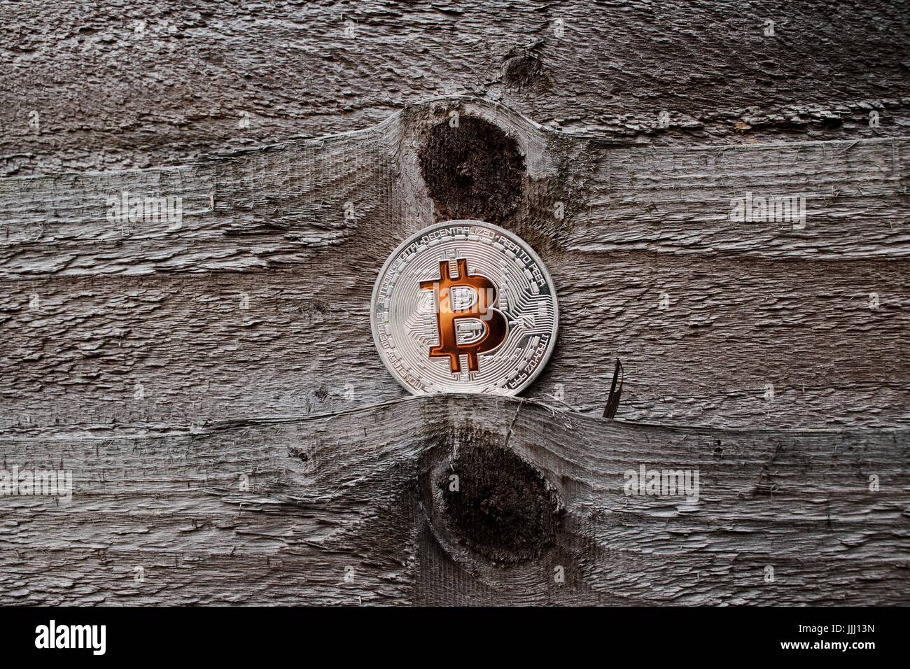 Digital currency physical silver bitcoin coin with orange sign on the ...