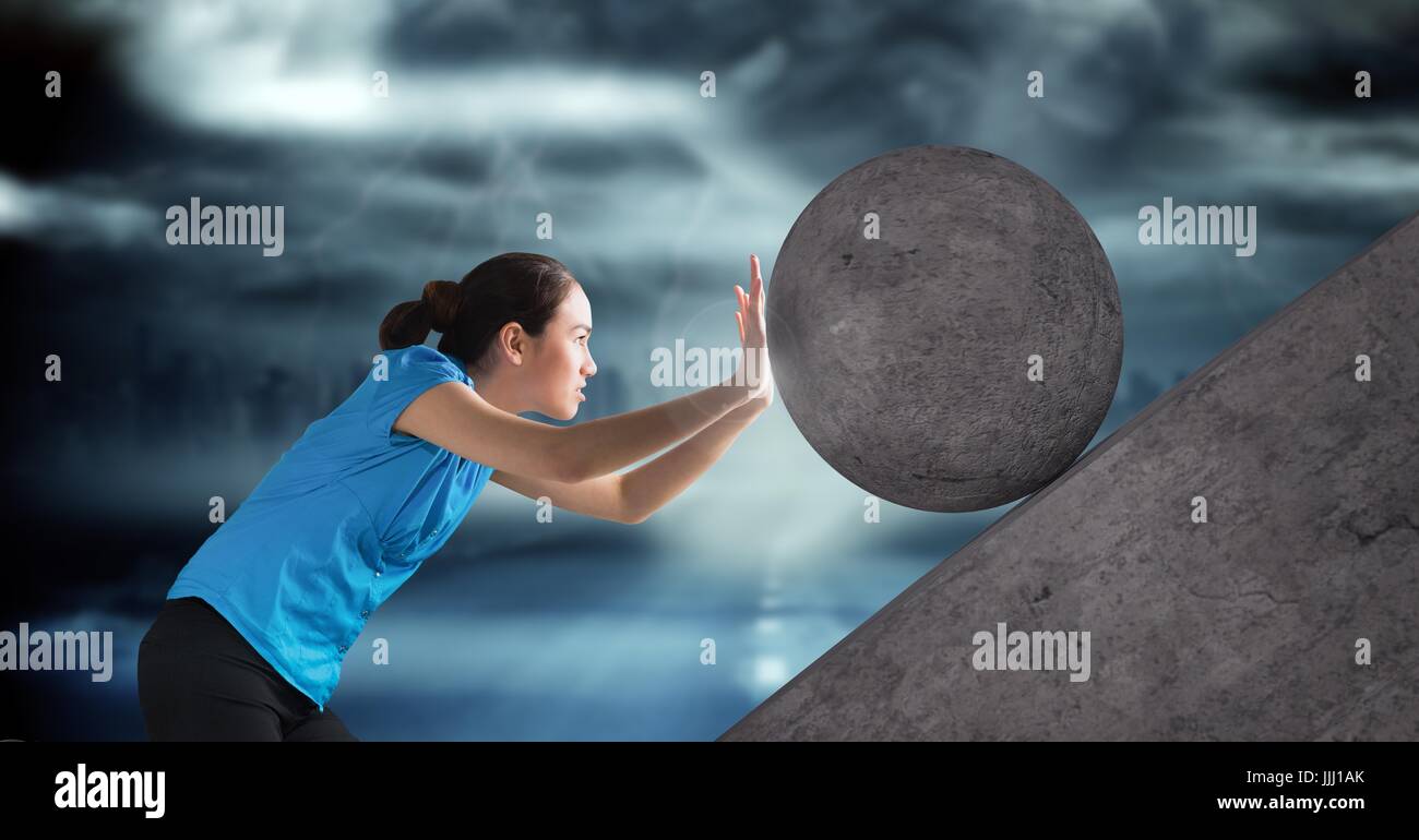 Woman pushing 3D rolling round rock Stock Photo - Alamy