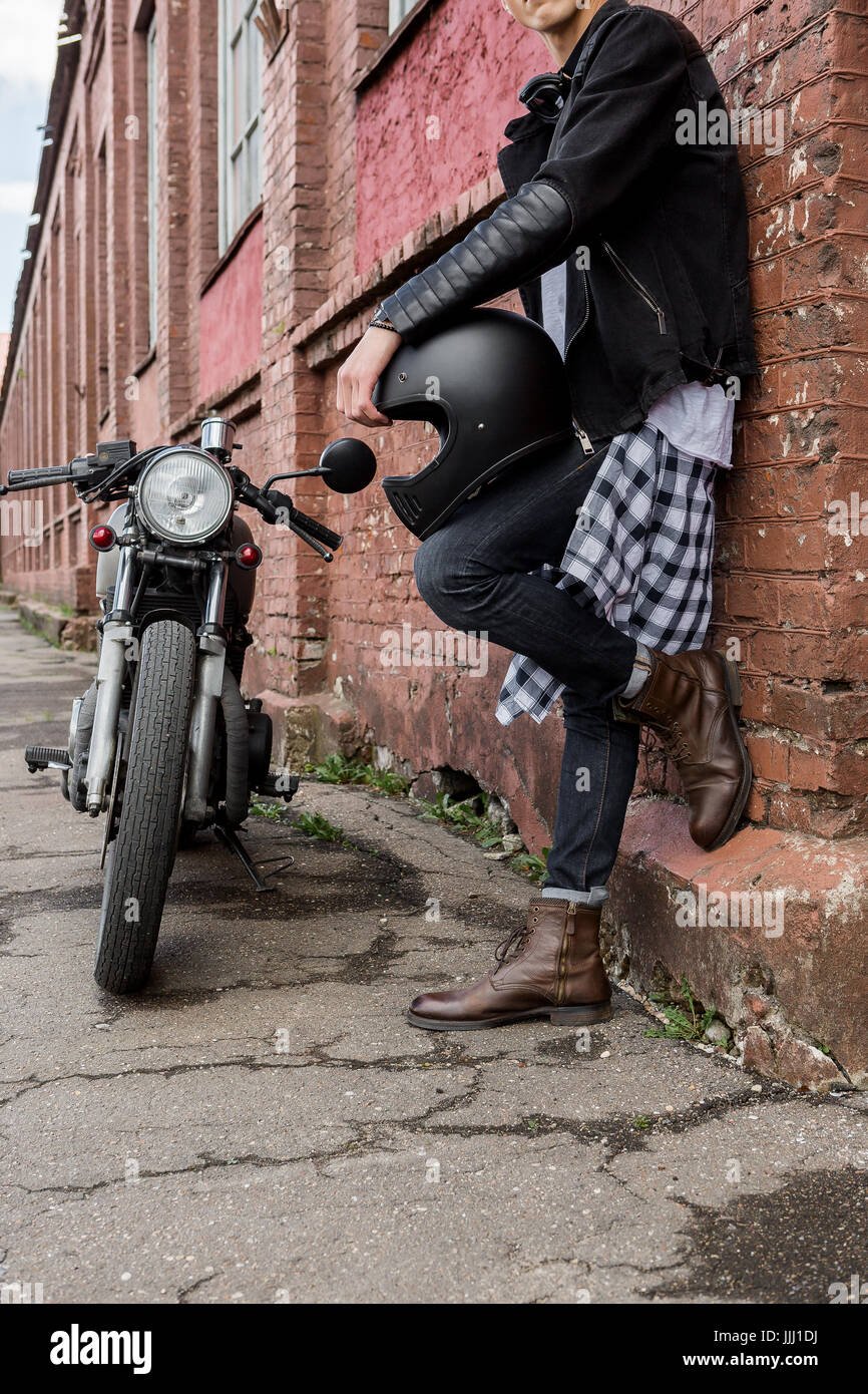 Close up of a handsome rider biker man hand with black helmet near ...