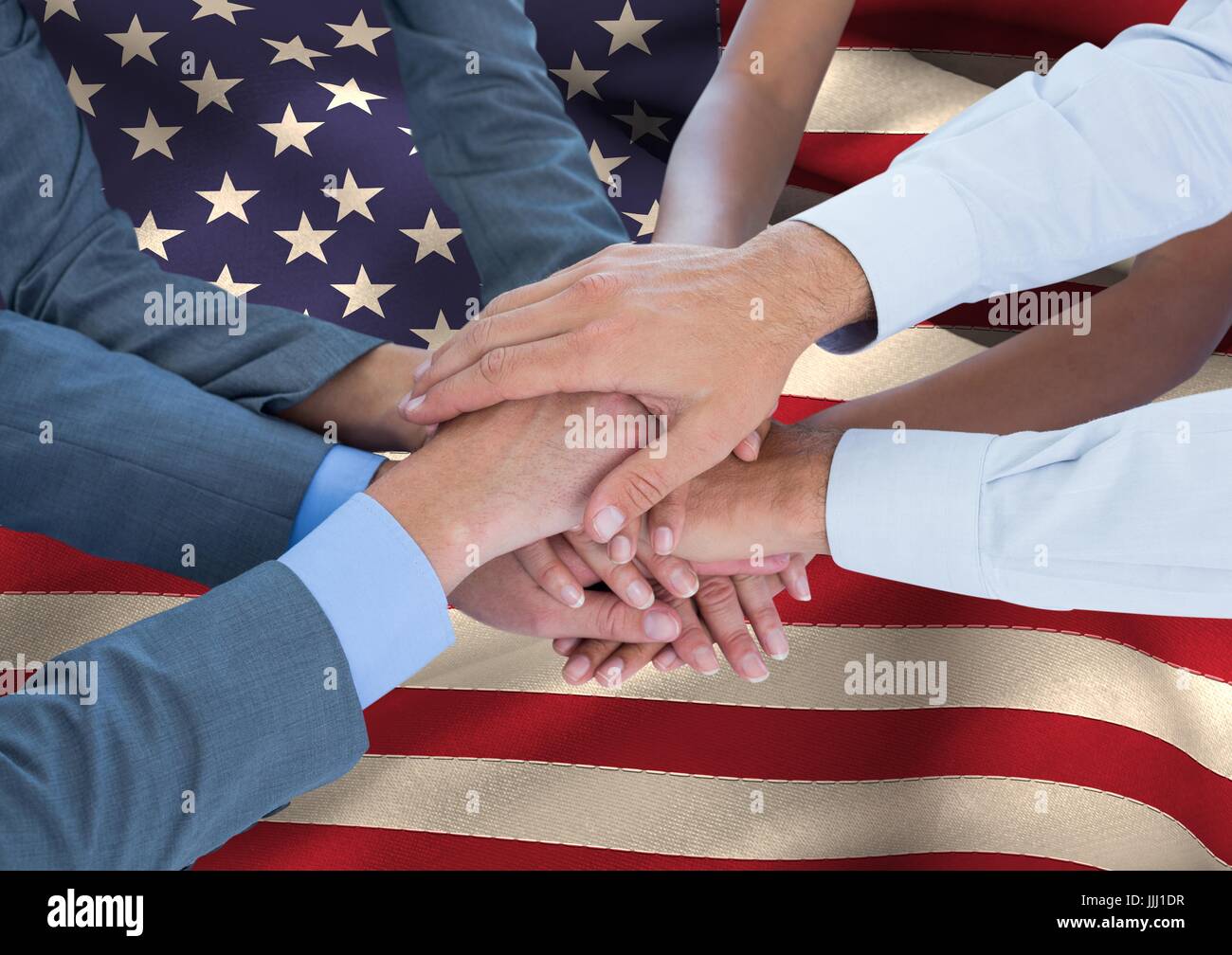People putting their hands together on an american flag Stock Photo - Alamy
