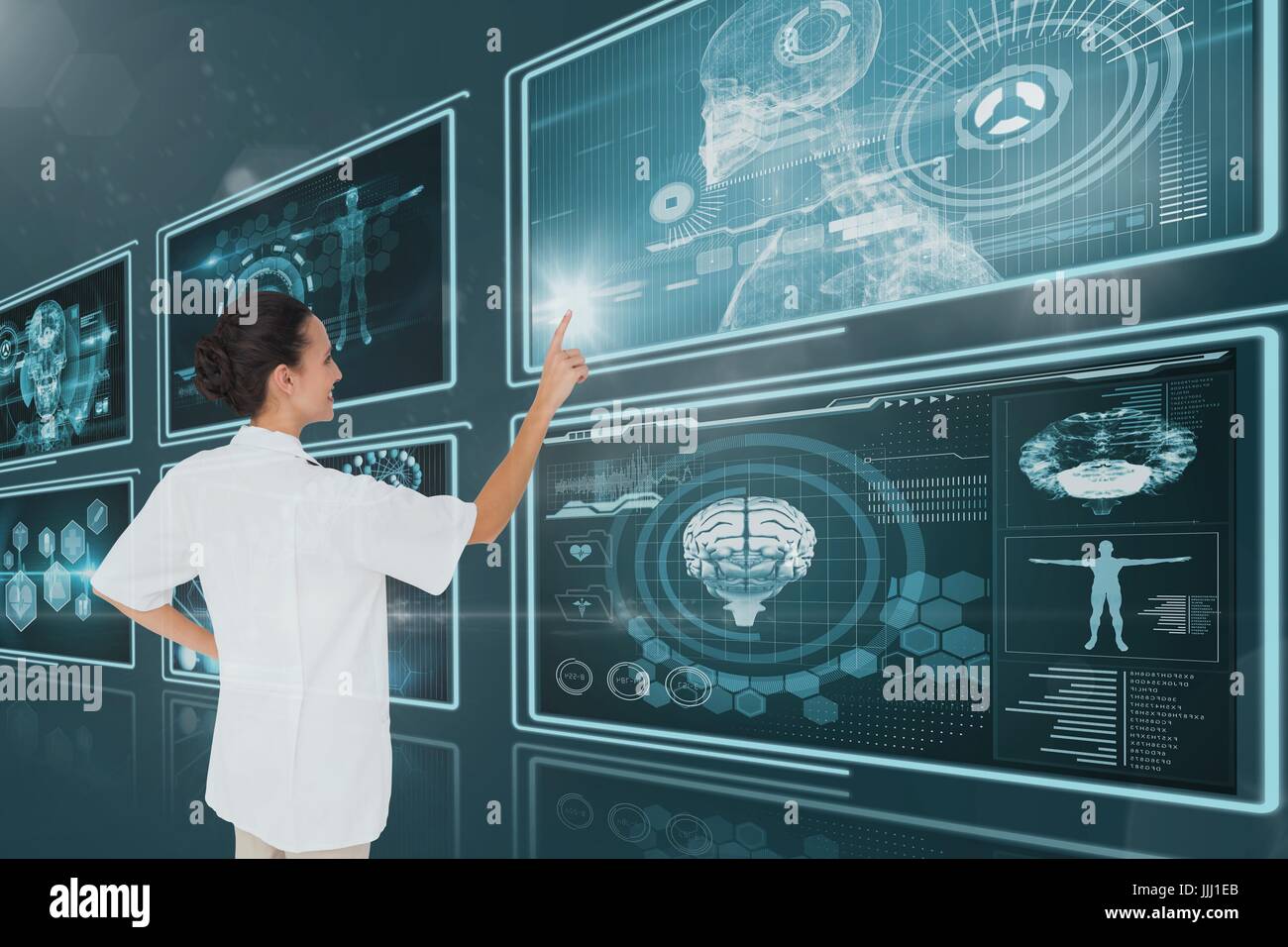 Woman doctor interacting with medical interfaces Stock Photo - Alamy