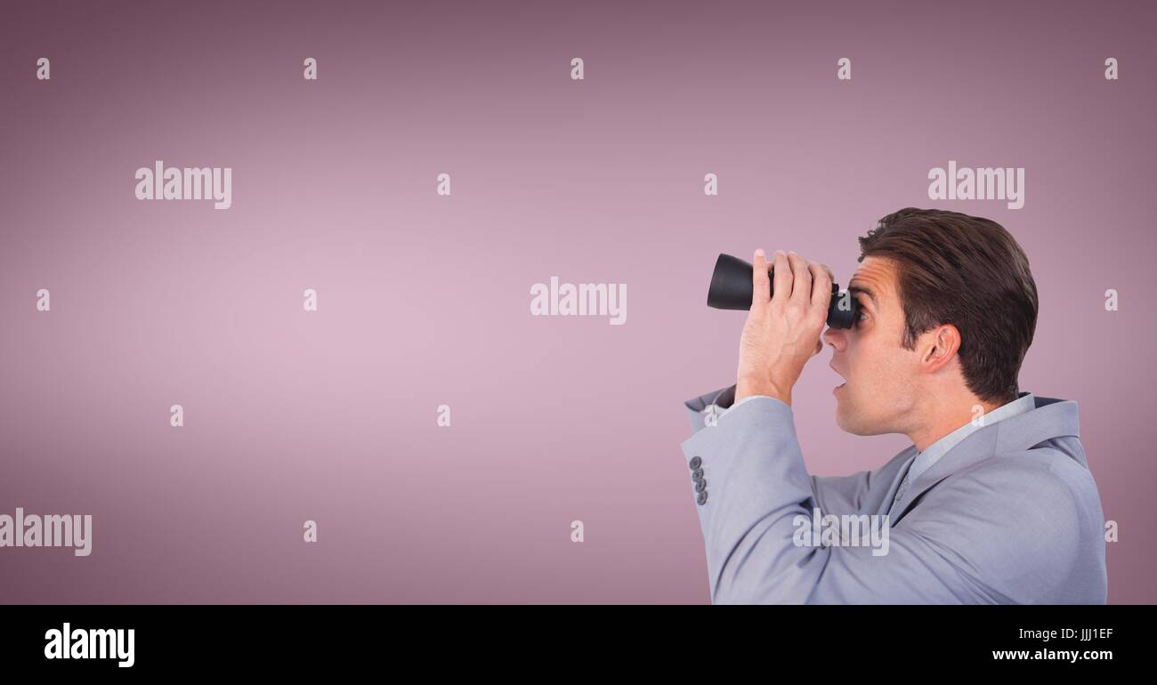Surprised man looking through binoculars against pink background Stock ...