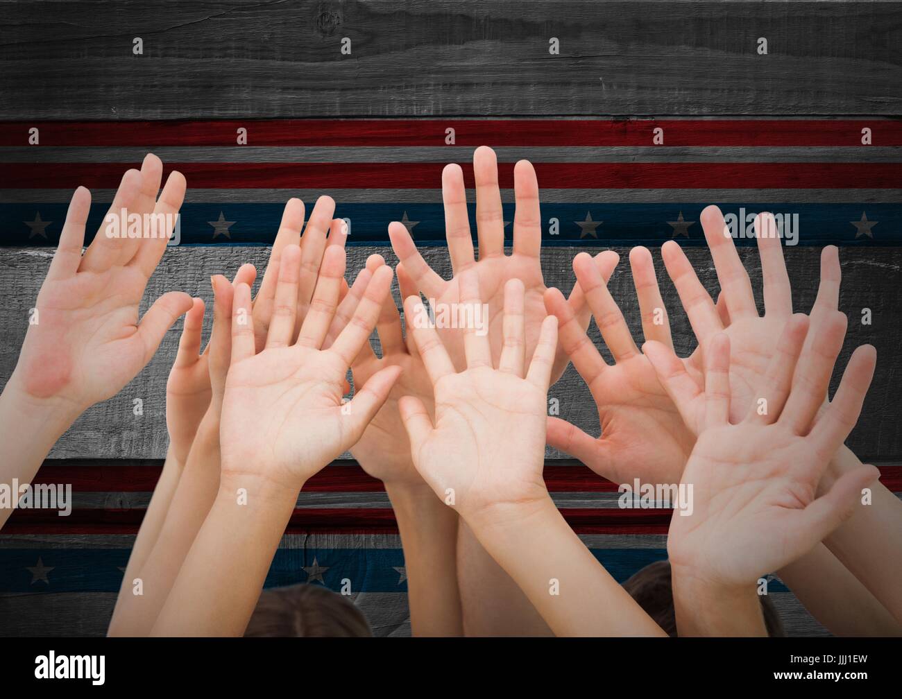 Hands up against american flag in background Stock Photo - Alamy