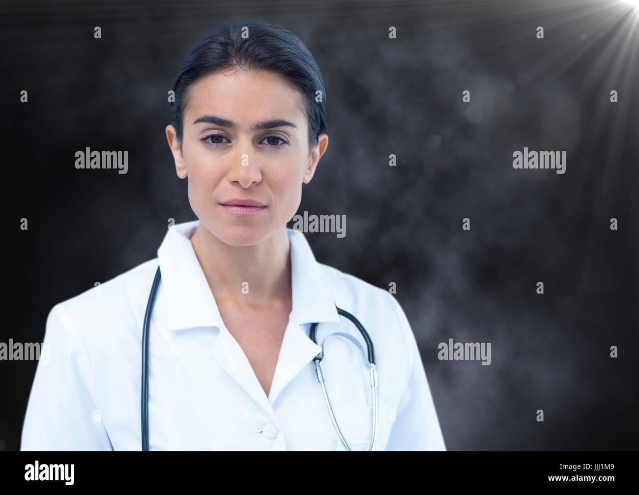 Female doctor against mist and flare Stock Photo - Alamy
