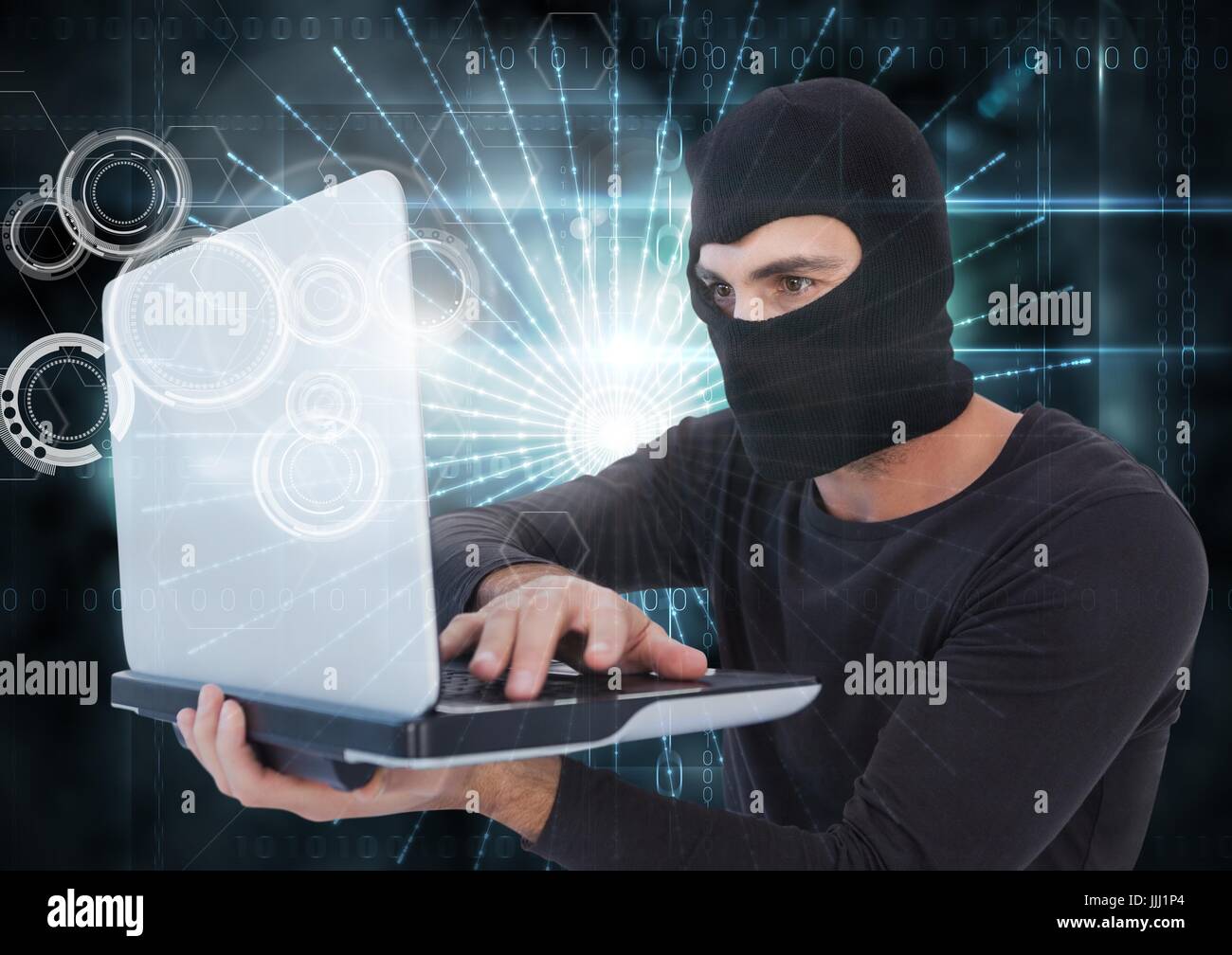3d Hacker with hood using a laptop in front of digital background Stock ...