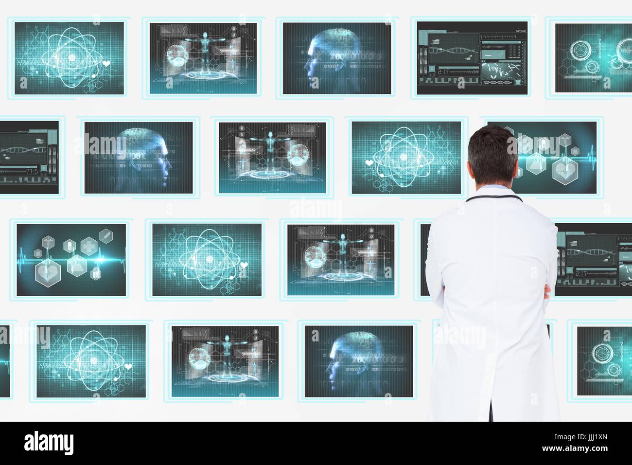 Man doctor looking at 3d medical interfaces against white background ...