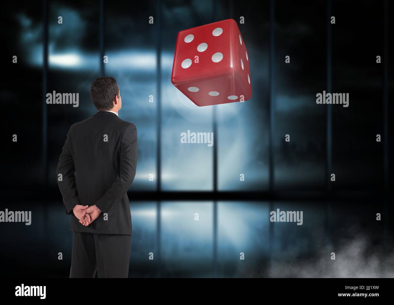 Back of Man Looking at 3d dice Stock Photo - Alamy