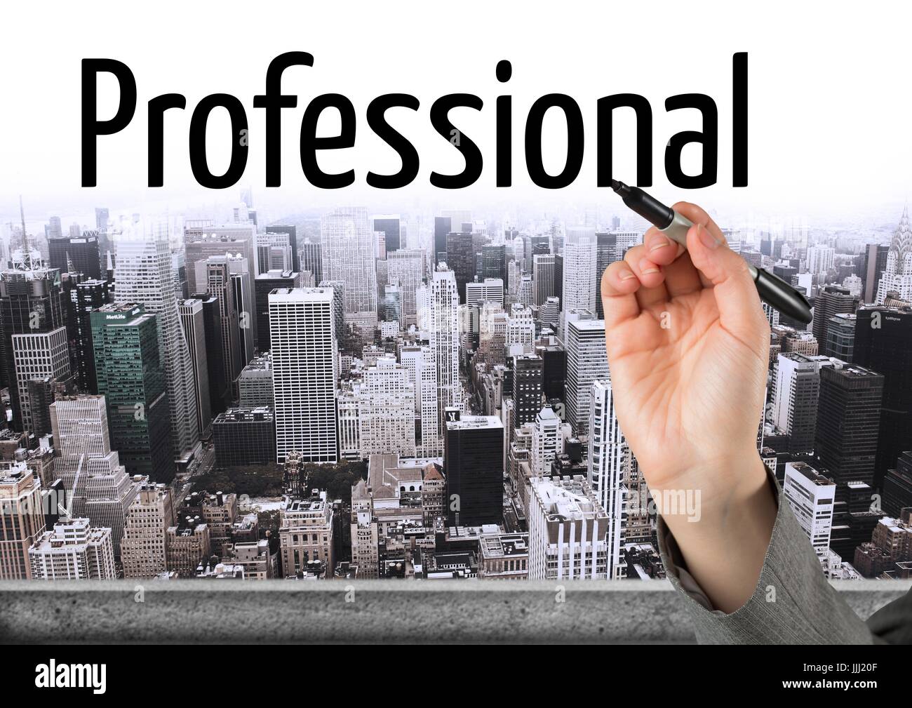 PROFESSIONAL write on the screen. In front of the city Stock Photo - Alamy