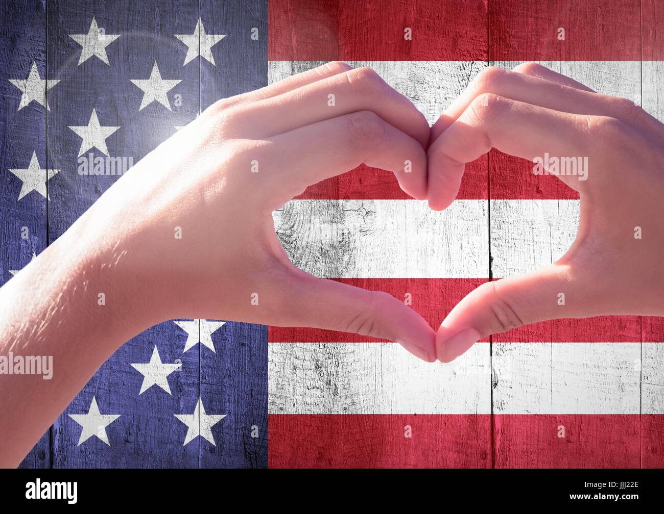 Hands showing a heart against american flag Stock Photo - Alamy