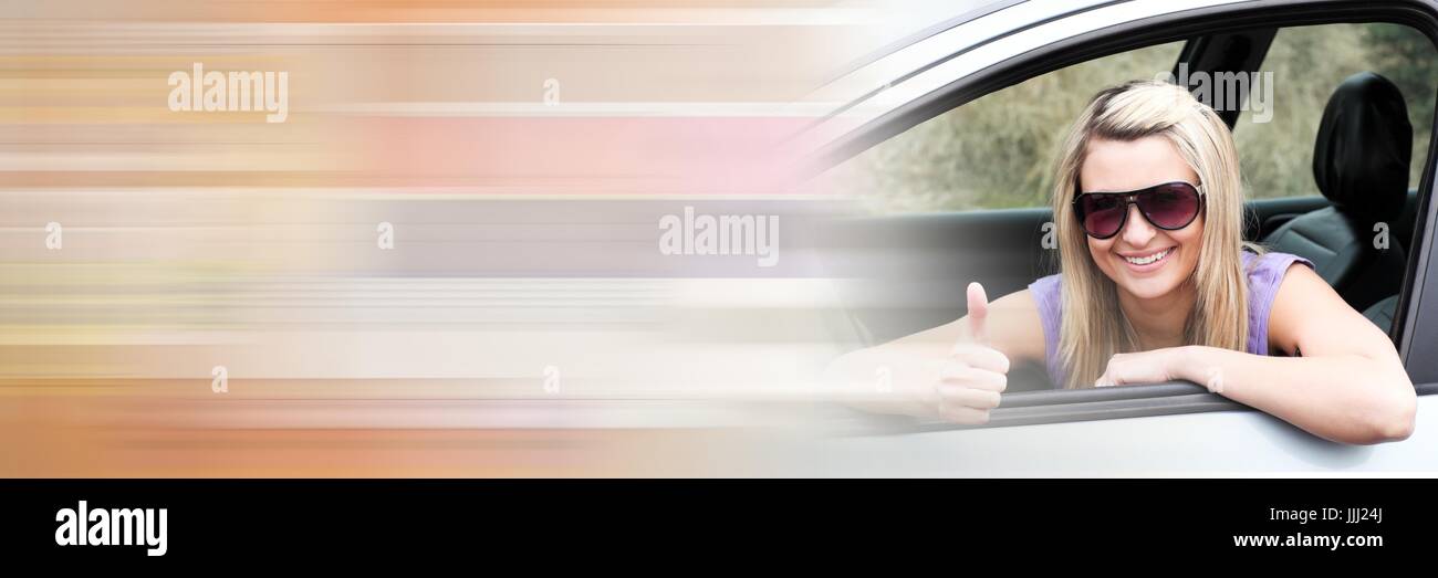 Woman in car with thumbs up with copy space transition Stock Photo - Alamy