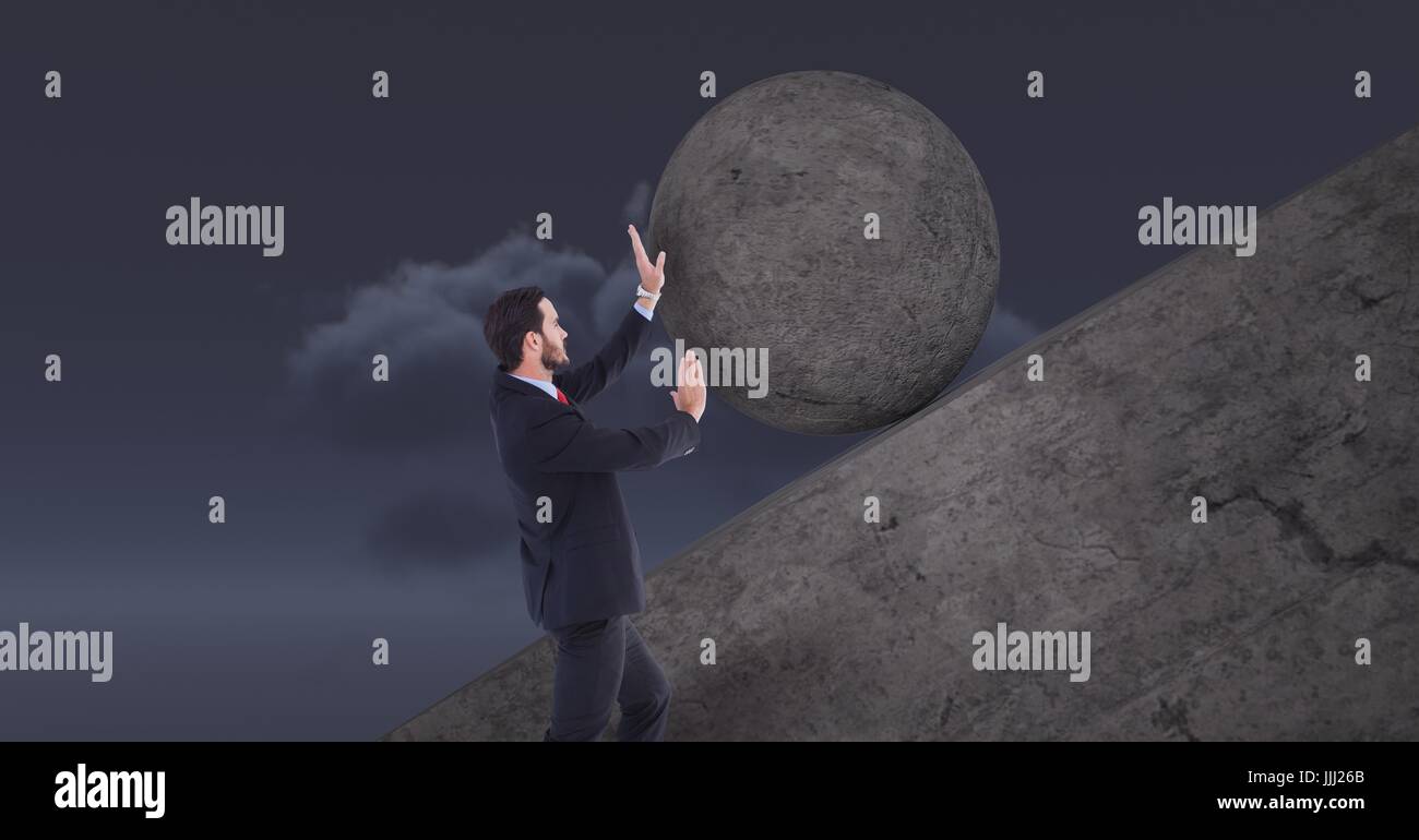 Man pushing rolling round rock Stock Photo - Alamy