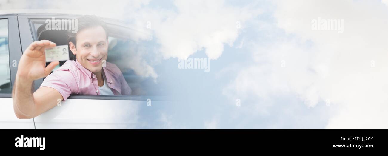 Man in car holding license card with transition Stock Photo - Alamy